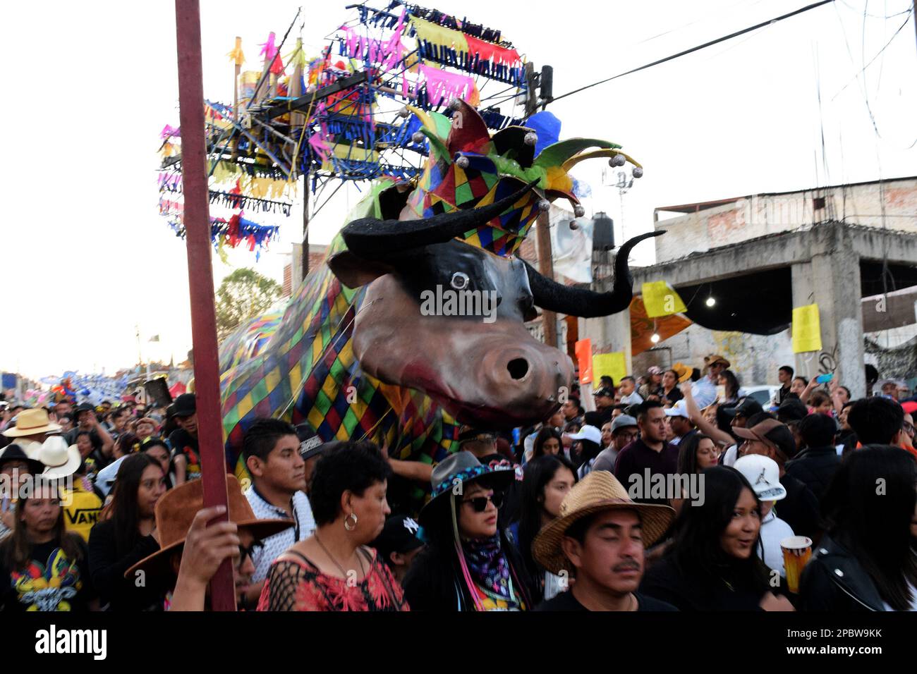 Non Exclusive: 08 March 2023, Tultepec, Mexico: Persons attend at monumental cardboard figures ...