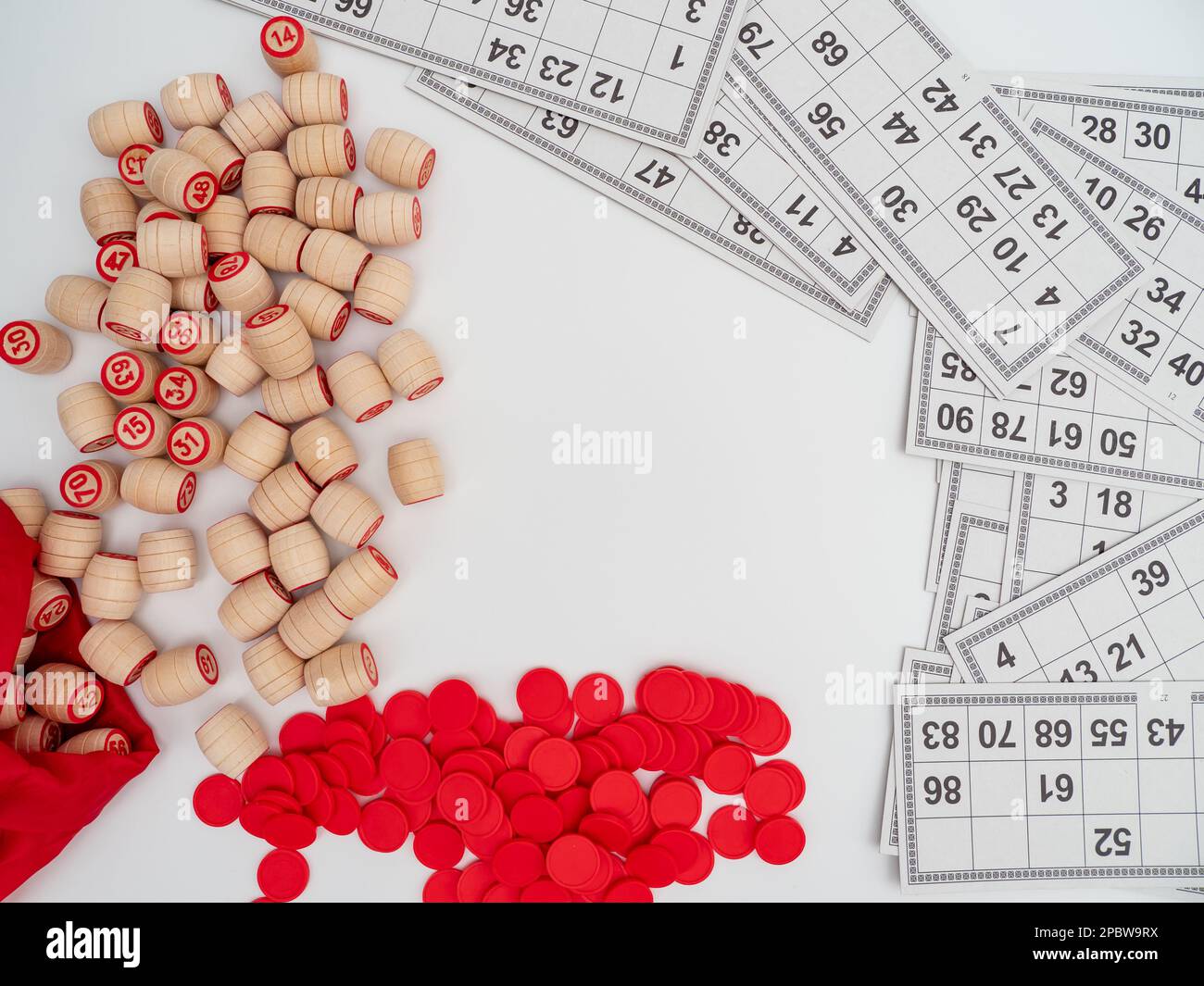 Board game bingo. Wooden barrels with lotto numbers, playing cards for ...
