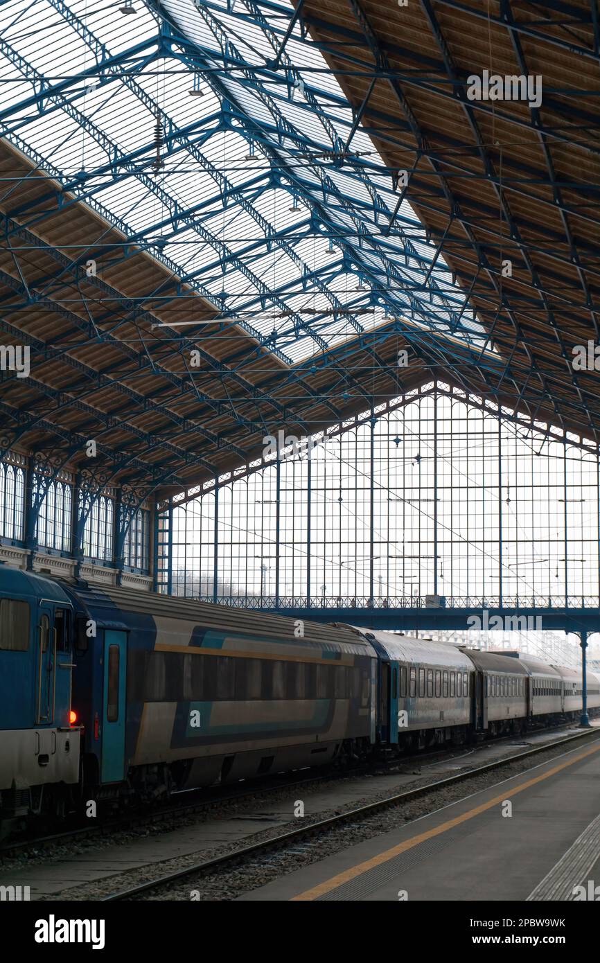 Train inside the glass and metal building of the railway station Stock ...