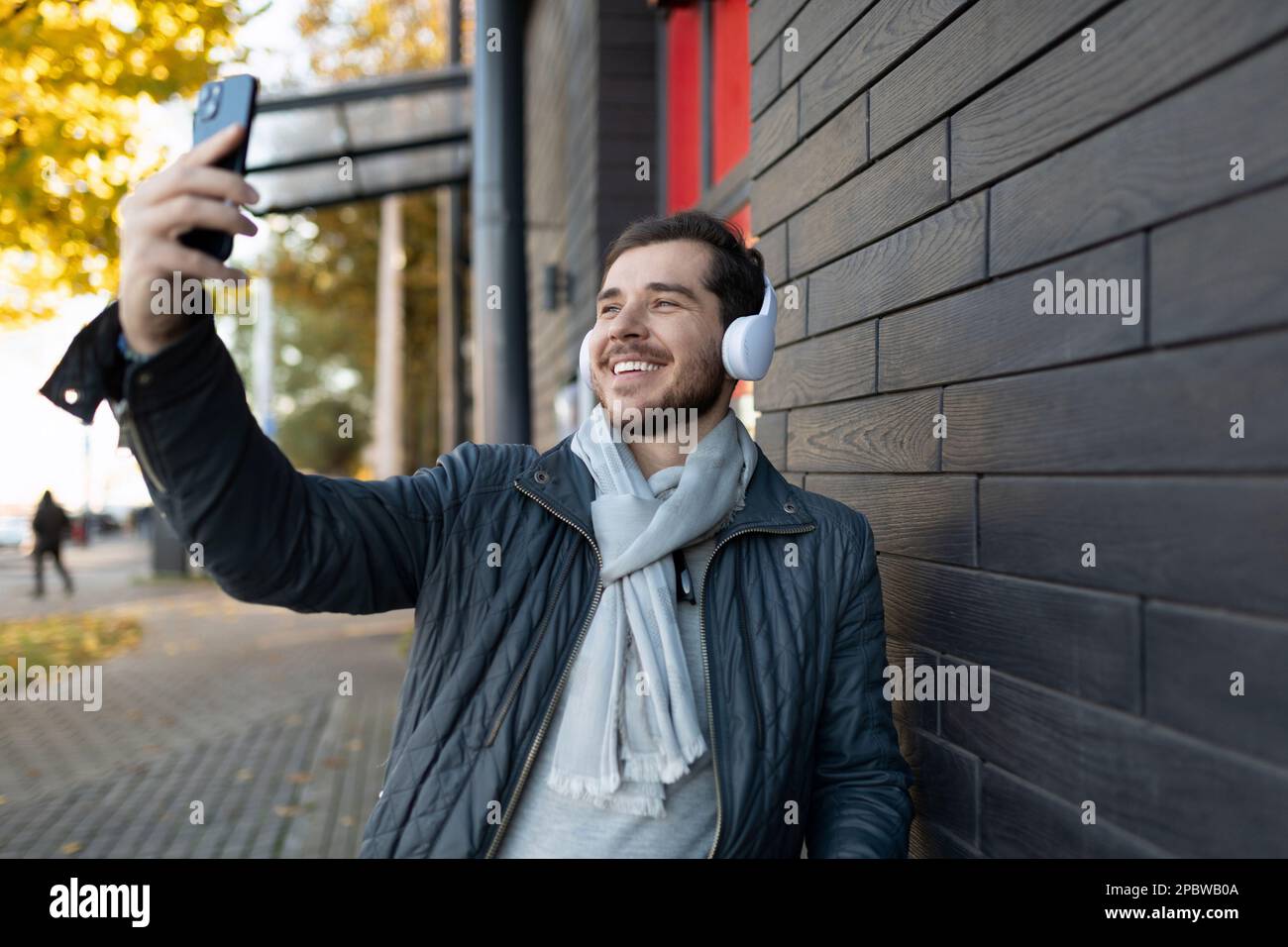 european male freelancer taking selfie with headphones outdoors Stock ...