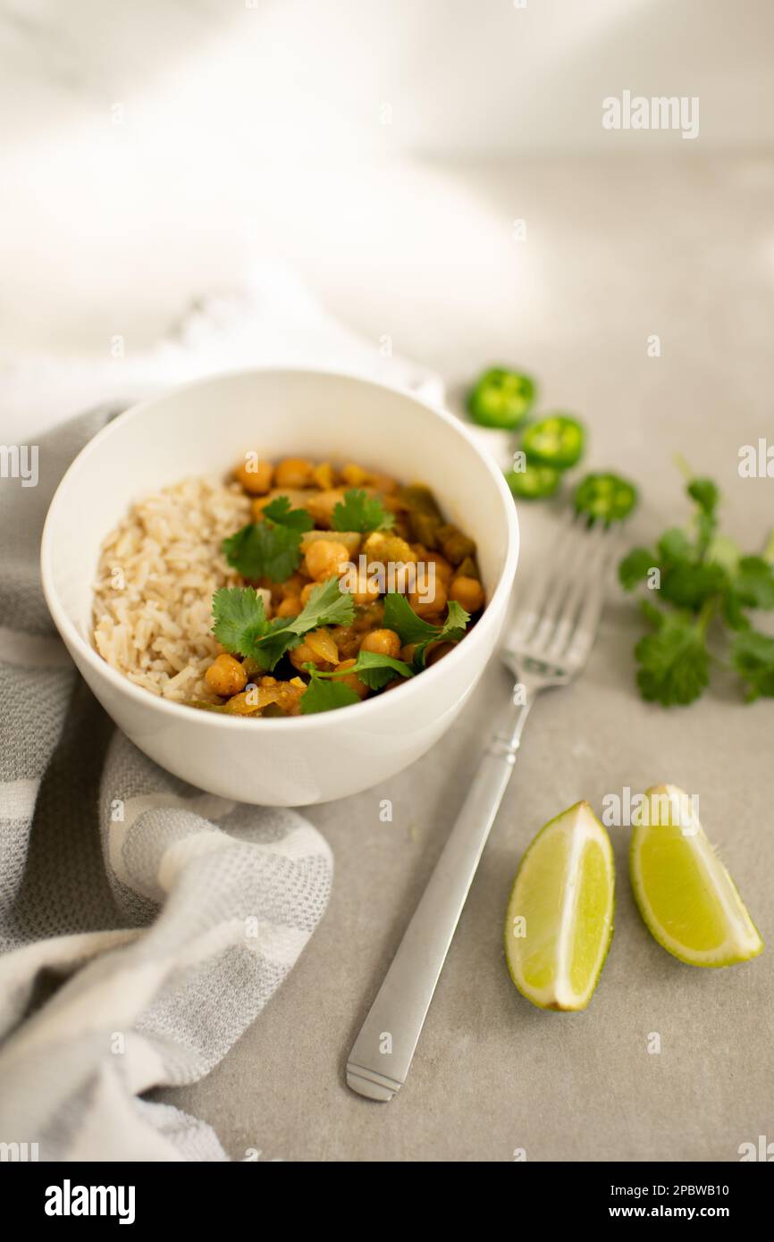 Chickpea Curry with Rice, Cilantro Garnish, Lime and Jalapeño Slices ...
