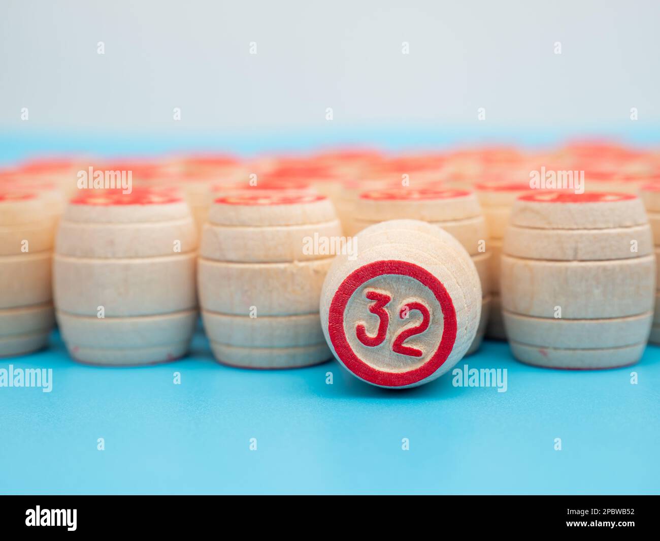 Board game bingo. Wooden barrels with lotto numbers, playing cards for ...