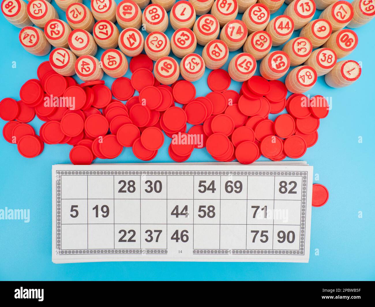 Board game bingo. Wooden barrels with lotto numbers, playing cards for ...
