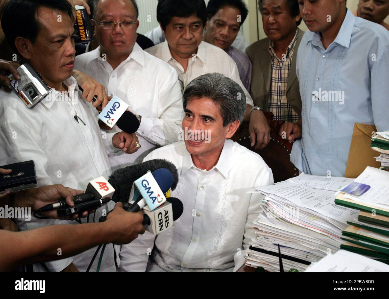 Detained former Senator Gregorio "Gringo" Honasan, seated, talks to the ...