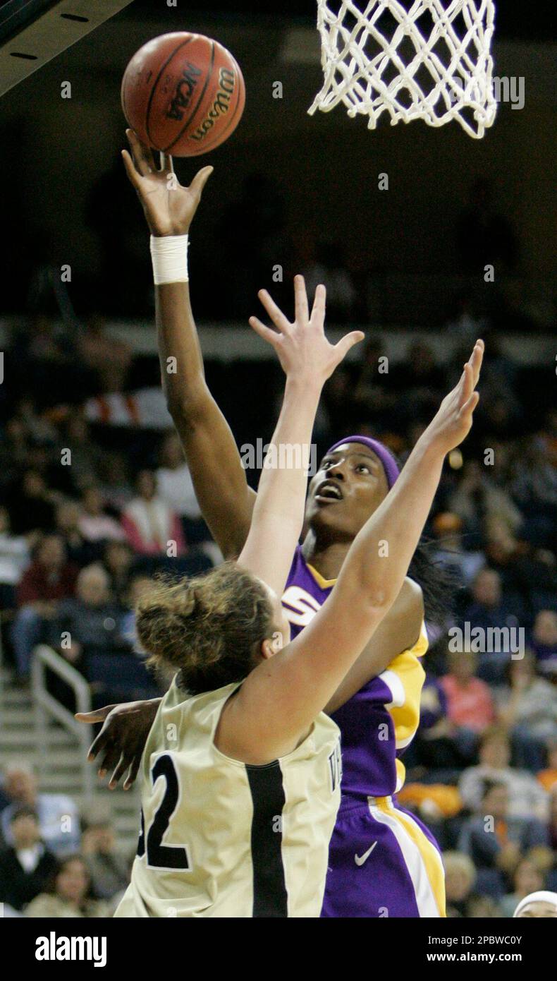 LSU's Sylvia Fowles, right, puts up a shot over Vanderbilt's Liz ...