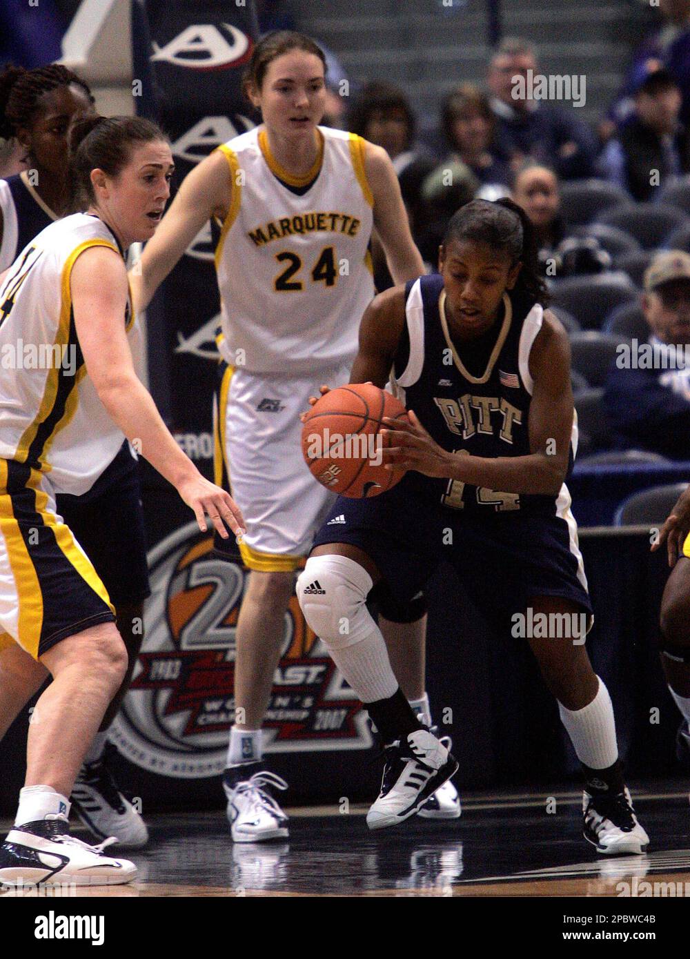 Pittsburgh's Jania Sims, right, breaks away from Marquette's Kelly Lam ...
