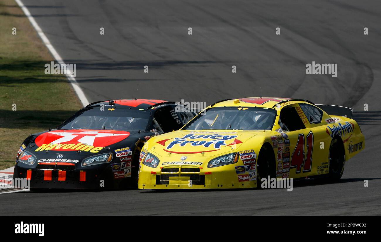 Juan Pablo Montoya of Colombia, left, and Scott Pruett, pass through ...
