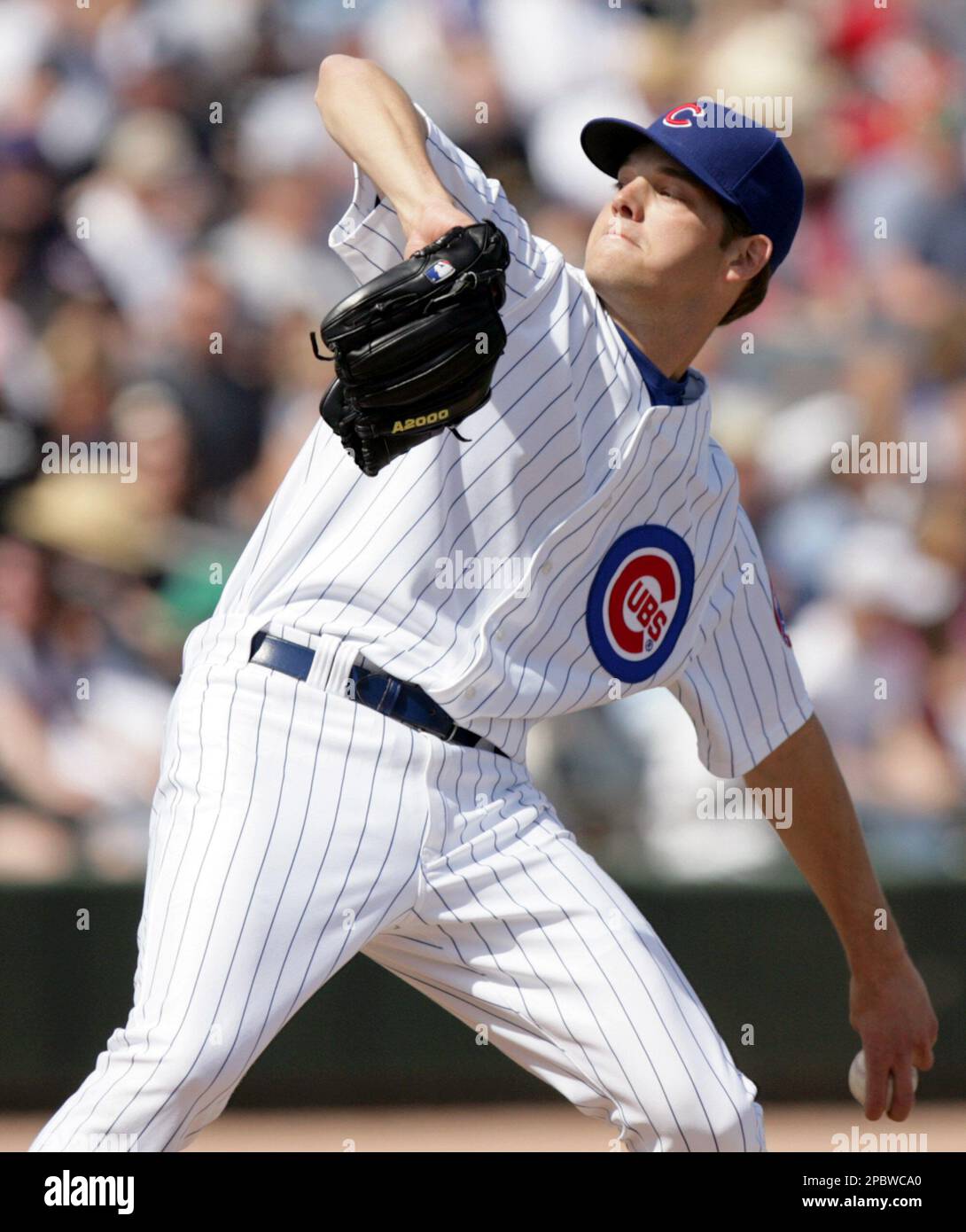 Chicago Cubs' Rich Hill winds up to deliver a pitch against the Chicago ...
