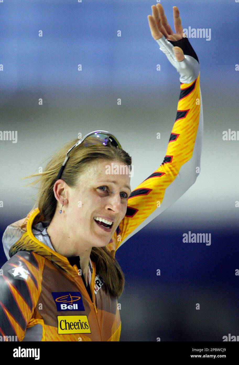 Kristina Groves, from Canada, waves to the crowd after her third place ...