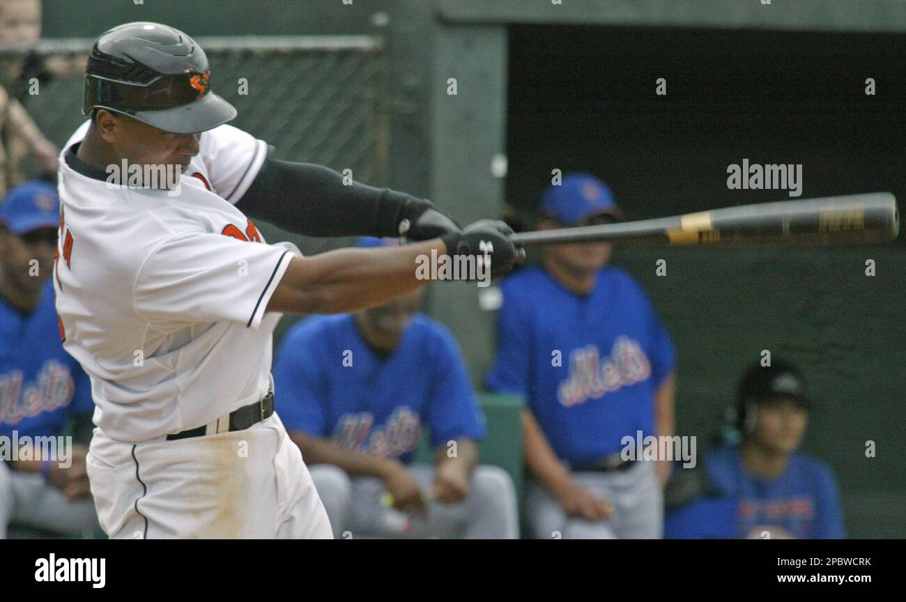 Baltimore Orioles' Melvin Mora connects for a three-run double against ...