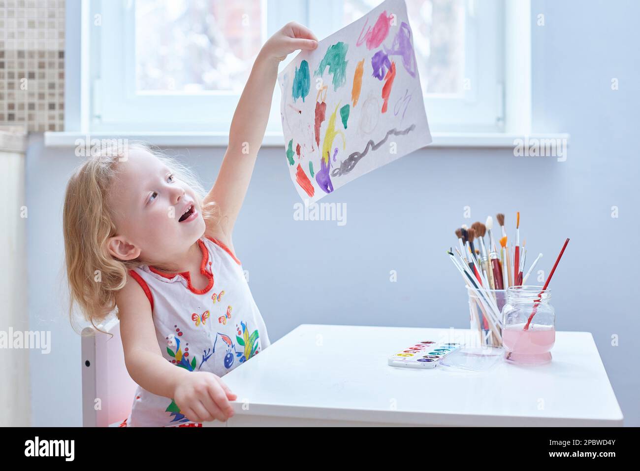 Todler is proud of his drawing. Kindergarten Stock Photo - Alamy