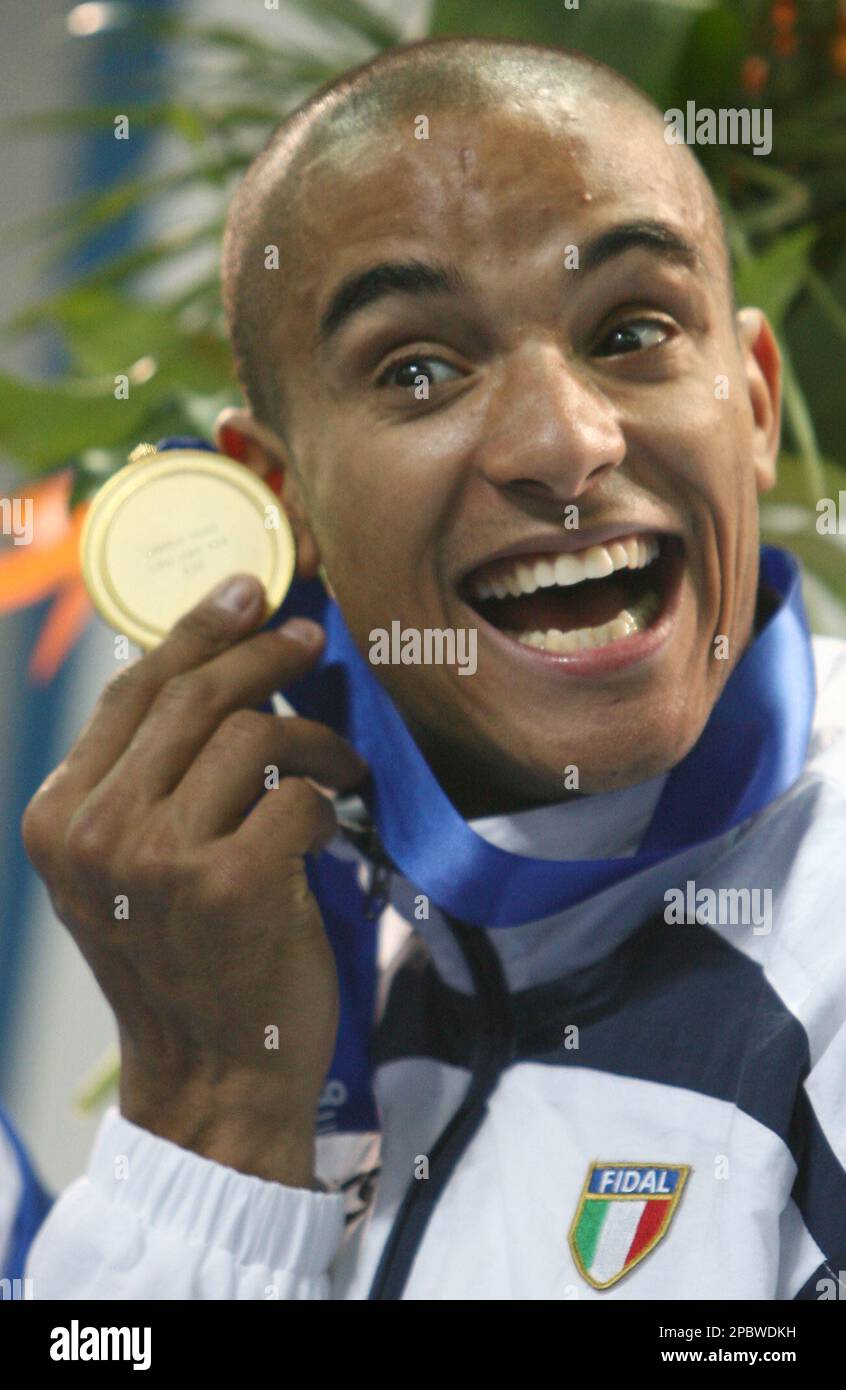 Italy's Andrew Howe poses with his gold medal during the medal ceremony ...