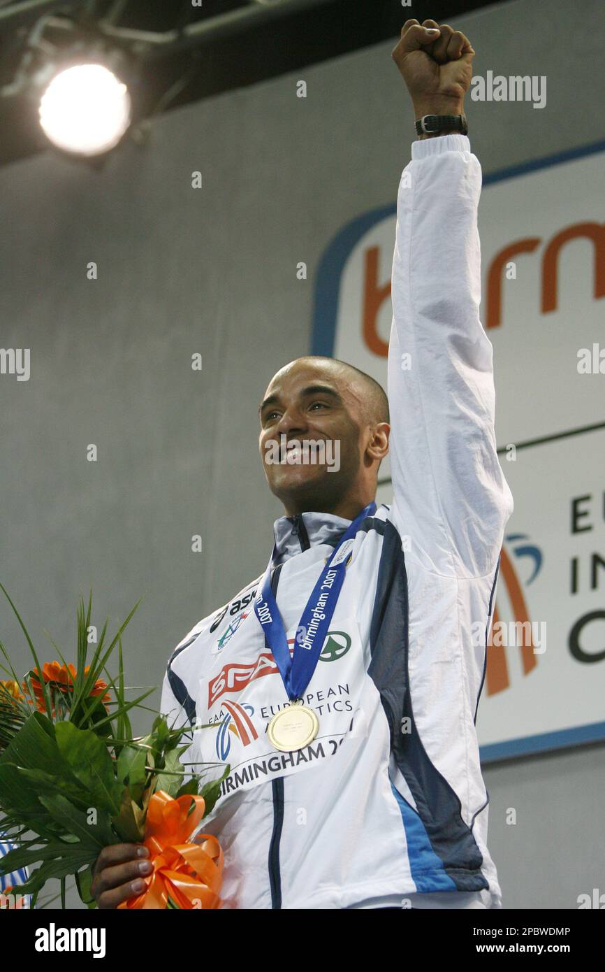 Italy's Andrew Howe poses with his gold medal during the medal ceremony ...