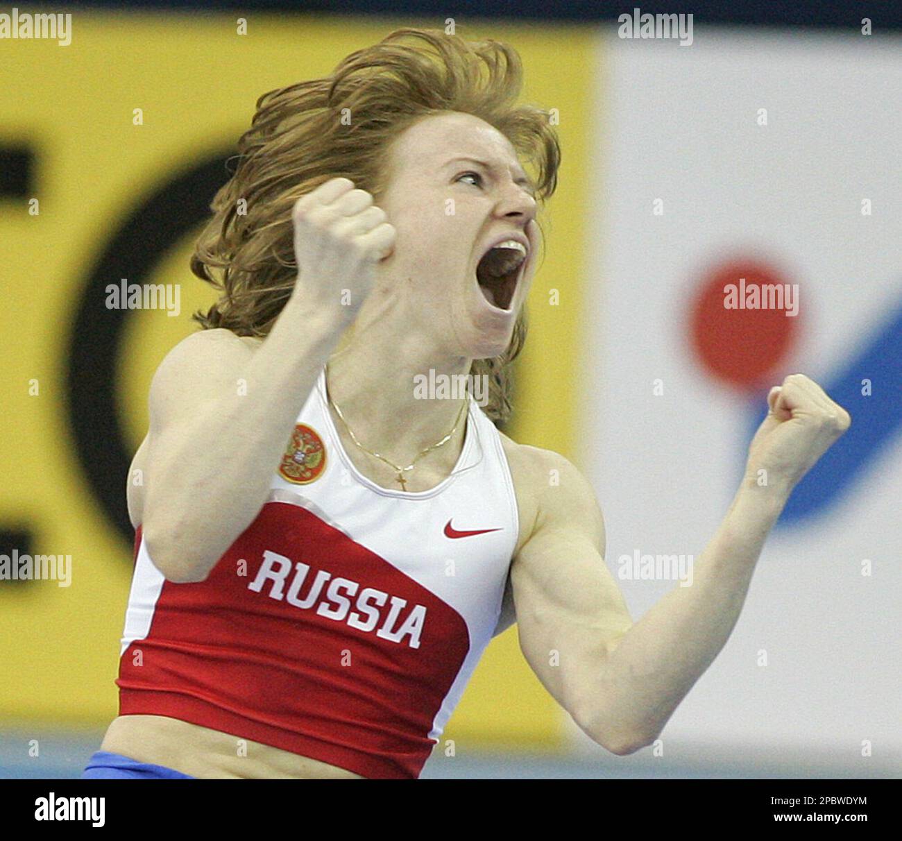 Svetlana Feofanova of Russia celebrates on her way to winning the gold ...