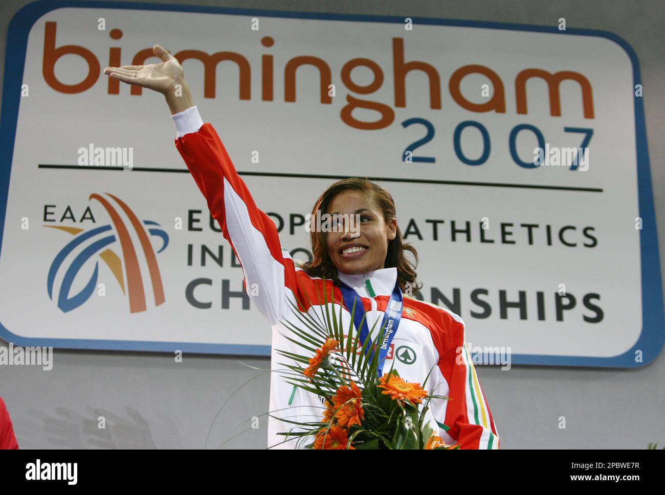 Portugal's Naide Gomes celebrates with her gold medal, after winning ...