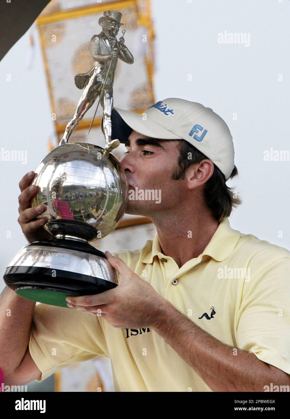 The winner South African Anton Haig kisses his winning trophy in ...