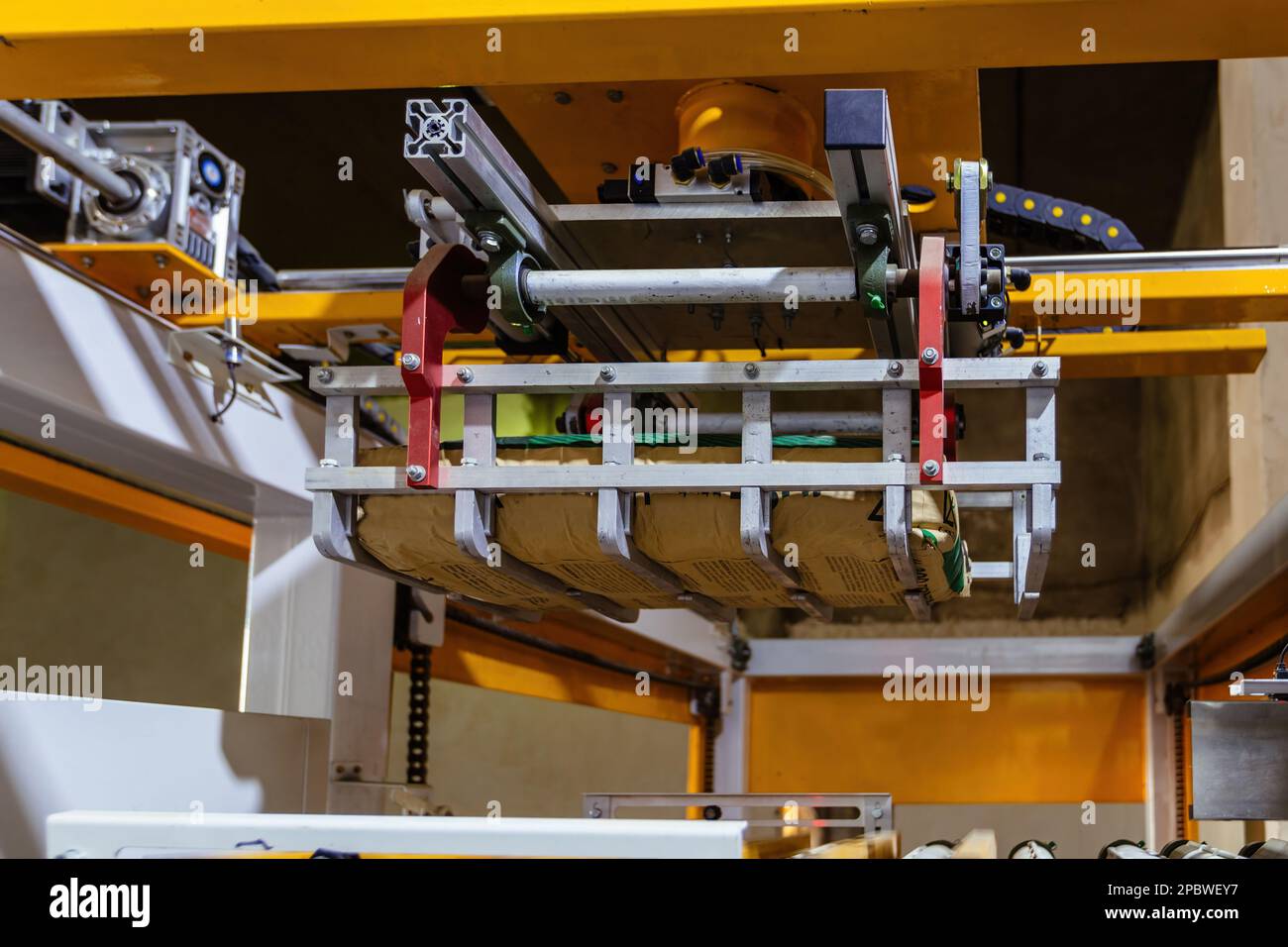 Lifting bag by jaw grip of stacking machine Stock Photo - Alamy