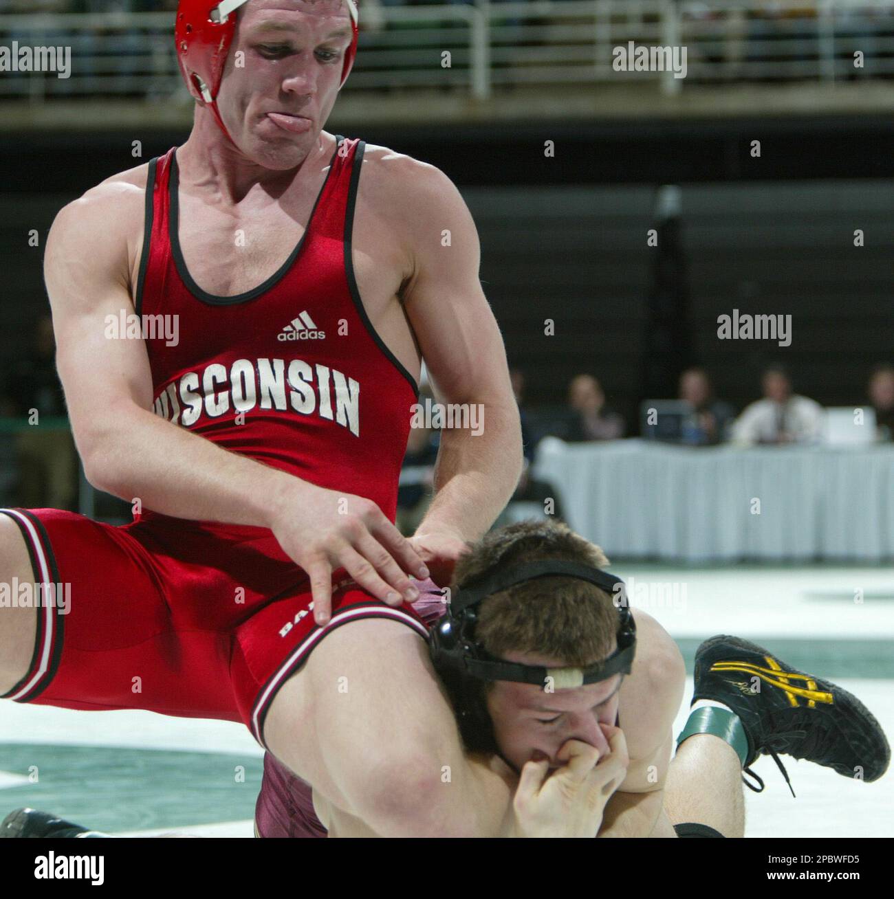 Wisconsin's Tyler Turner, left, and Minnesota's Dustin Schlatter ...
