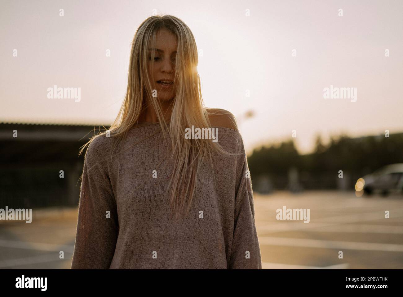 Beautiful young blonde woman with long hair smiling, close-up po Stock ...