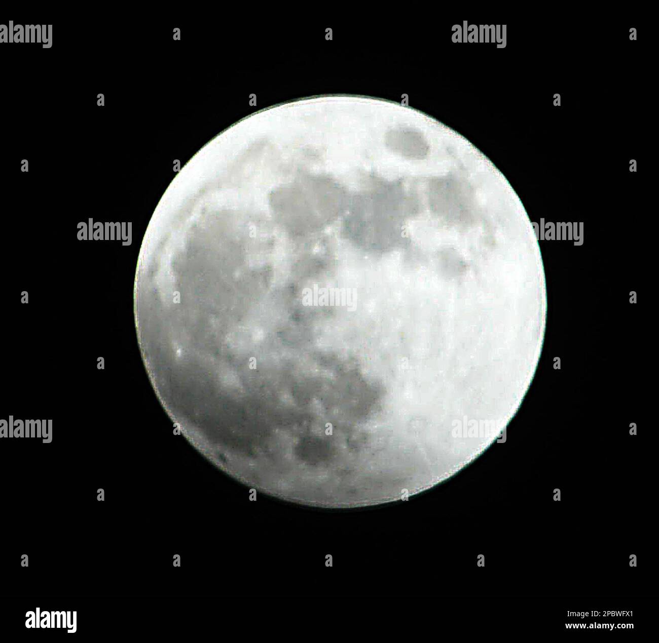 ** FIRST OF FOUR PHOTOS ** The full moon is seen before the start of ...