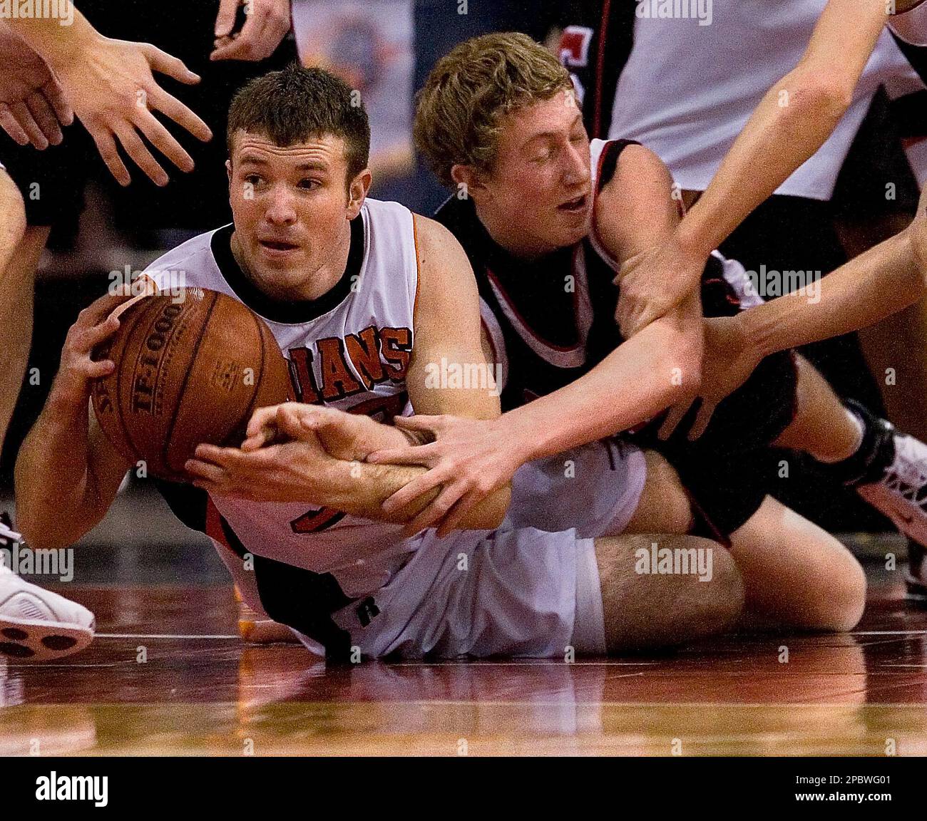 Buhl's Austin Laing scrambles for a loose ball against Shelley's Keegan ...