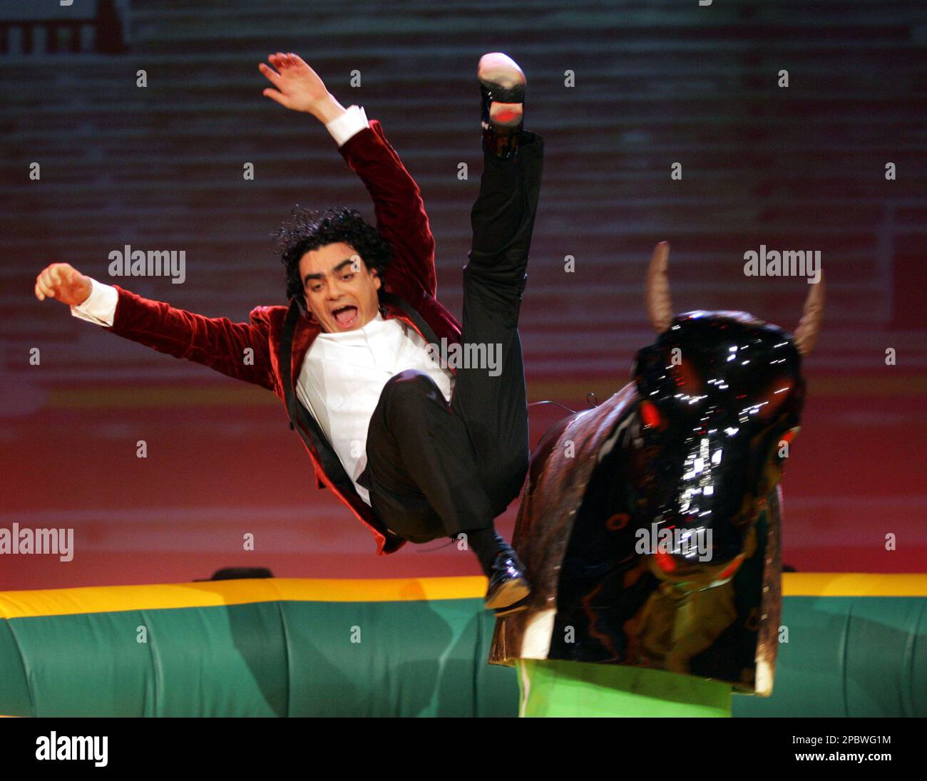 Mexican opera singer Rolando Villazon rides a bullrider during the ...