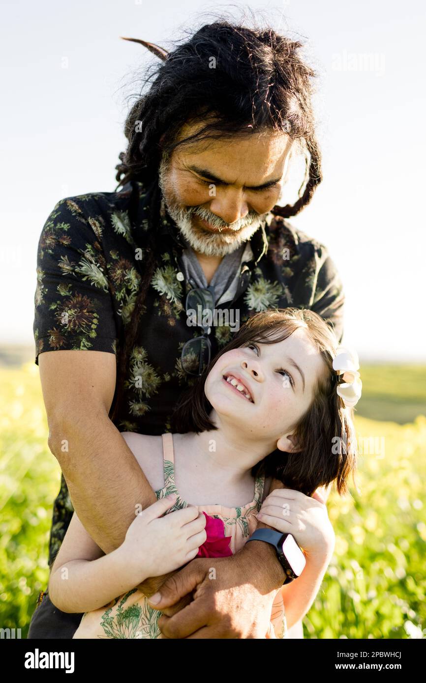 Uncle Embracing Niece in Flower Field in San Diego Stock Photo - Alamy