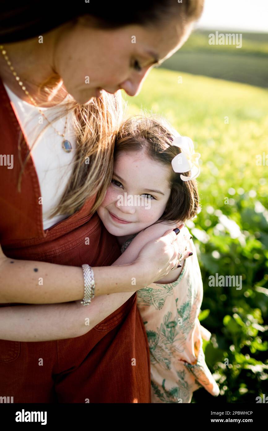 Seven Year Old Hugging Mom in Field in San Diego Stock Photo - Alamy
