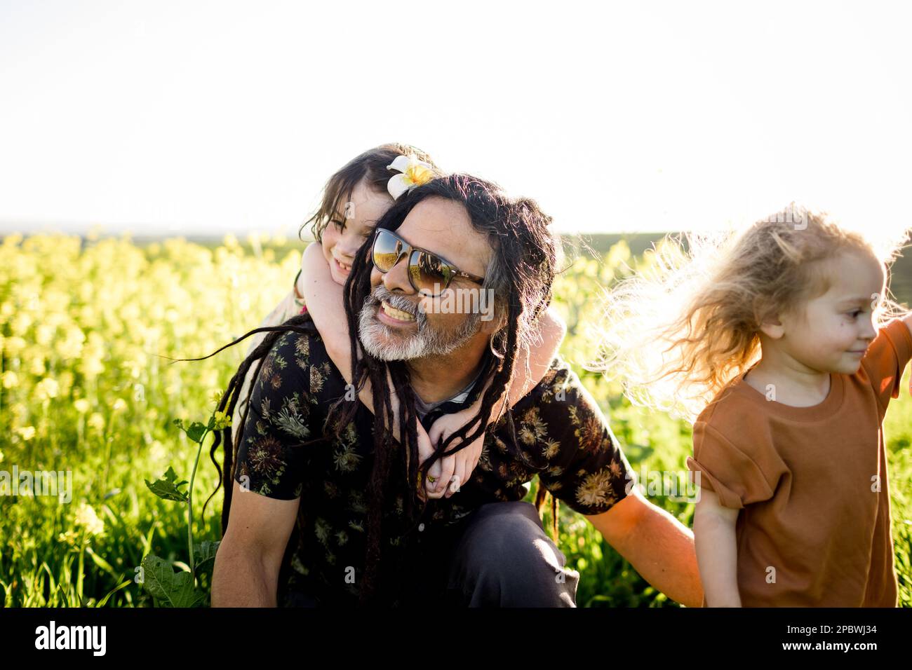 Uncle & Nieces in Flower Field in San Diego Stock Photo - Alamy