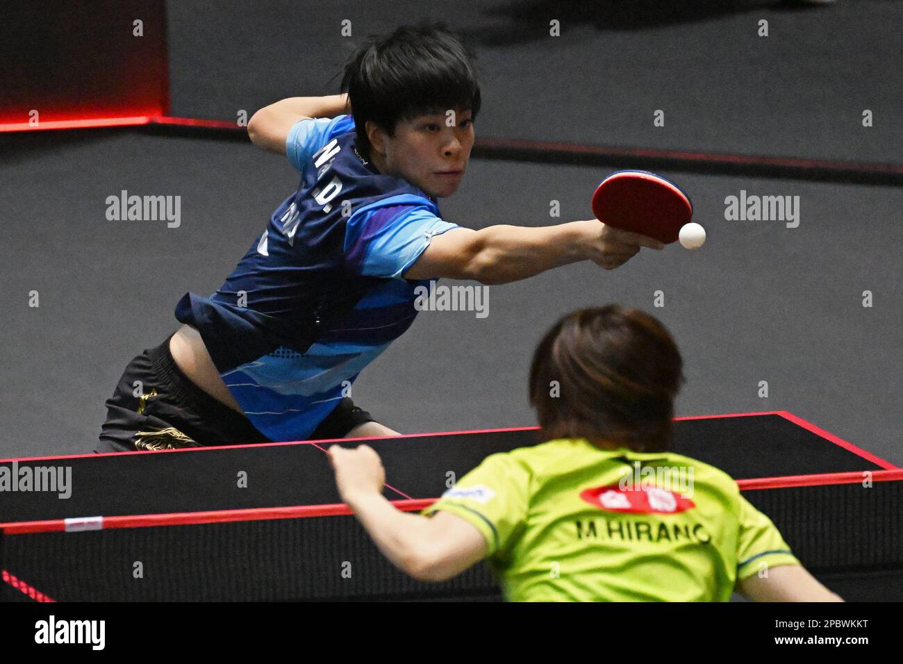 Singapore. 13th Mar, 2023. Wang Yidi (top) of China hits a return ...