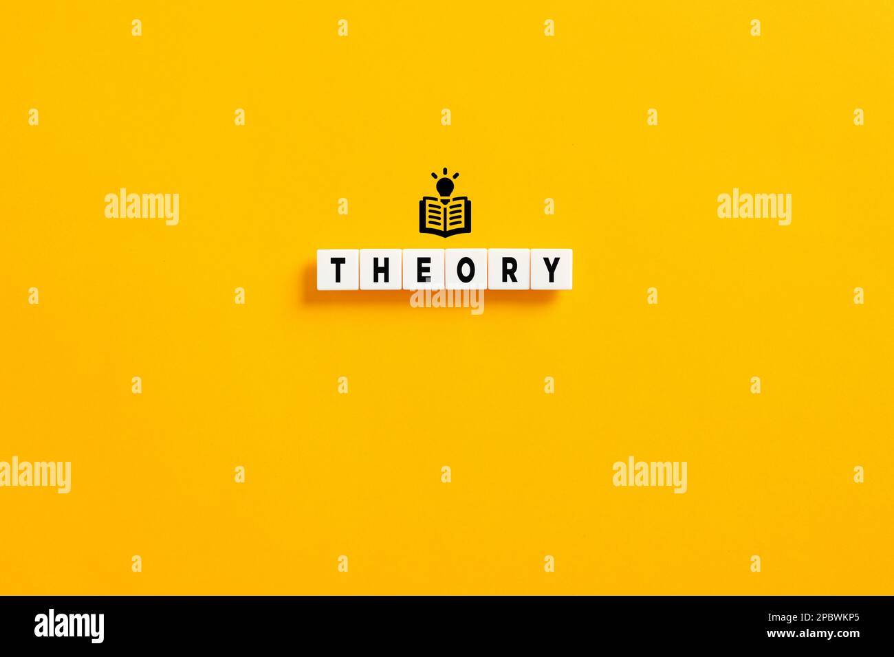 White letter blocks on yellow background with the word theory ...
