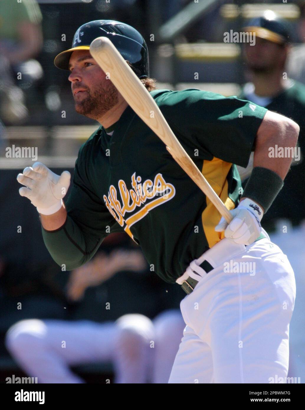 Oakland Athletics' Mike Piazza watches his grounder that scored a run ...