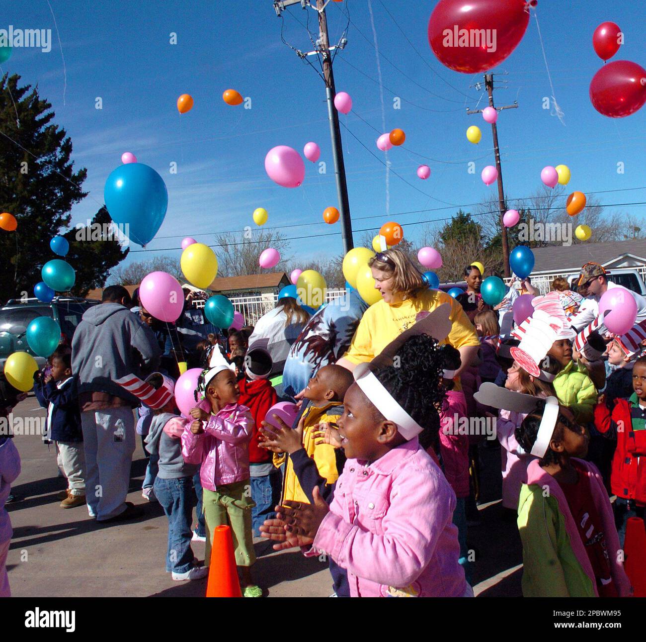 Givens Elementary School student Nakauria Frierson, center, claps and ...