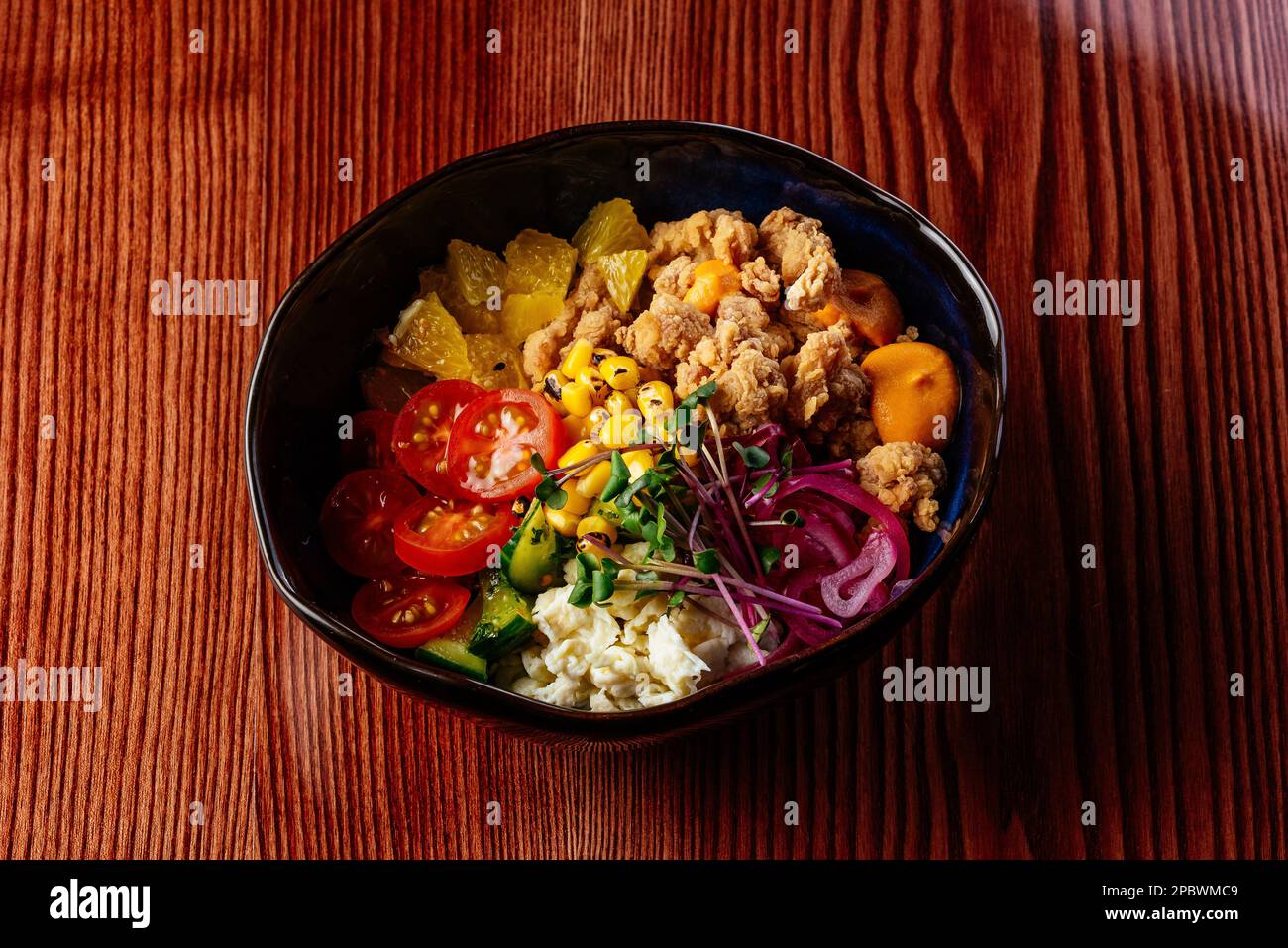 hawaiian poke bowl with chicken, vegetables, rice Stock Photo - Alamy