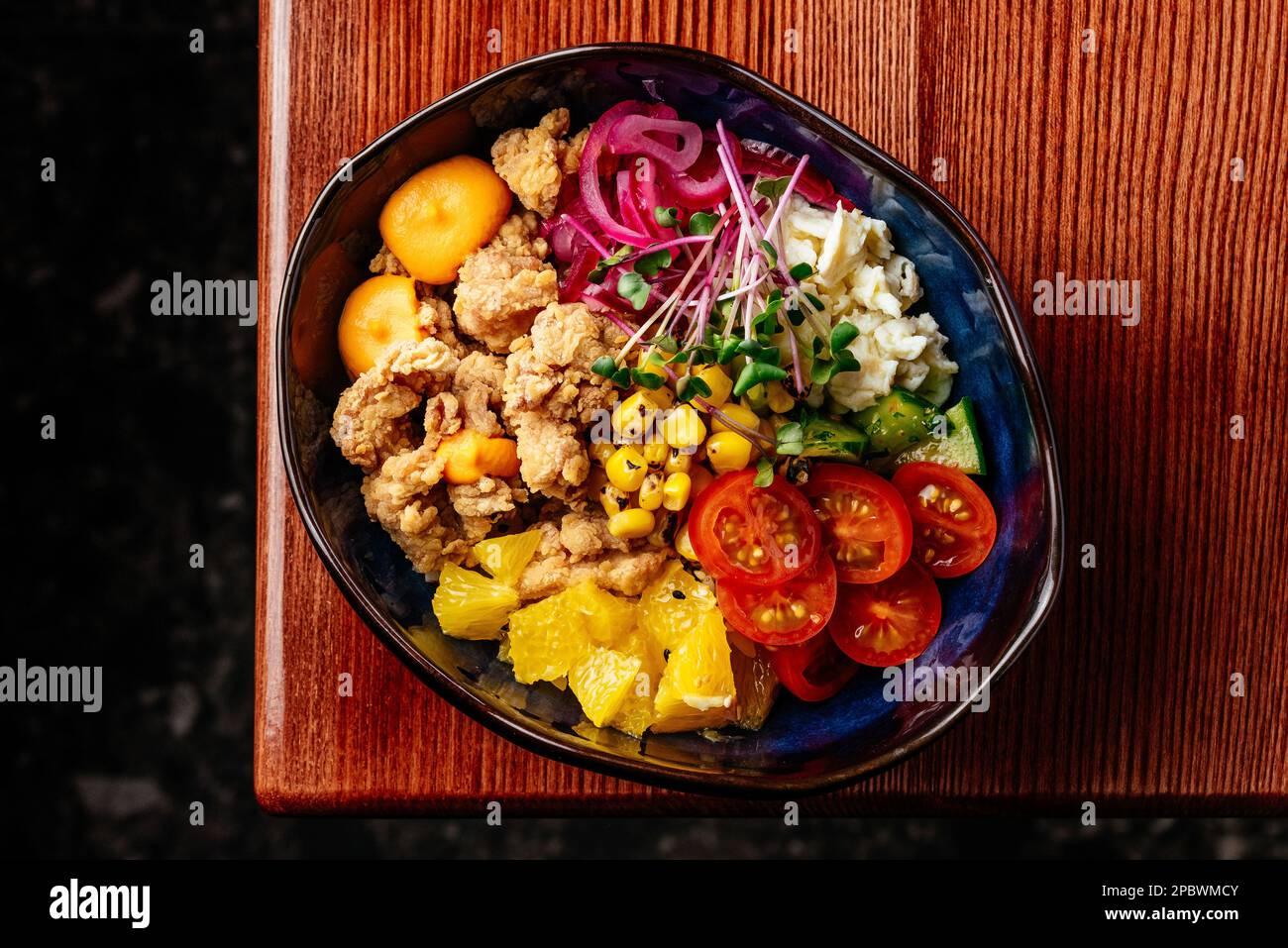 hawaiian poke bowl with chicken, vegetables, rice Stock Photo - Alamy