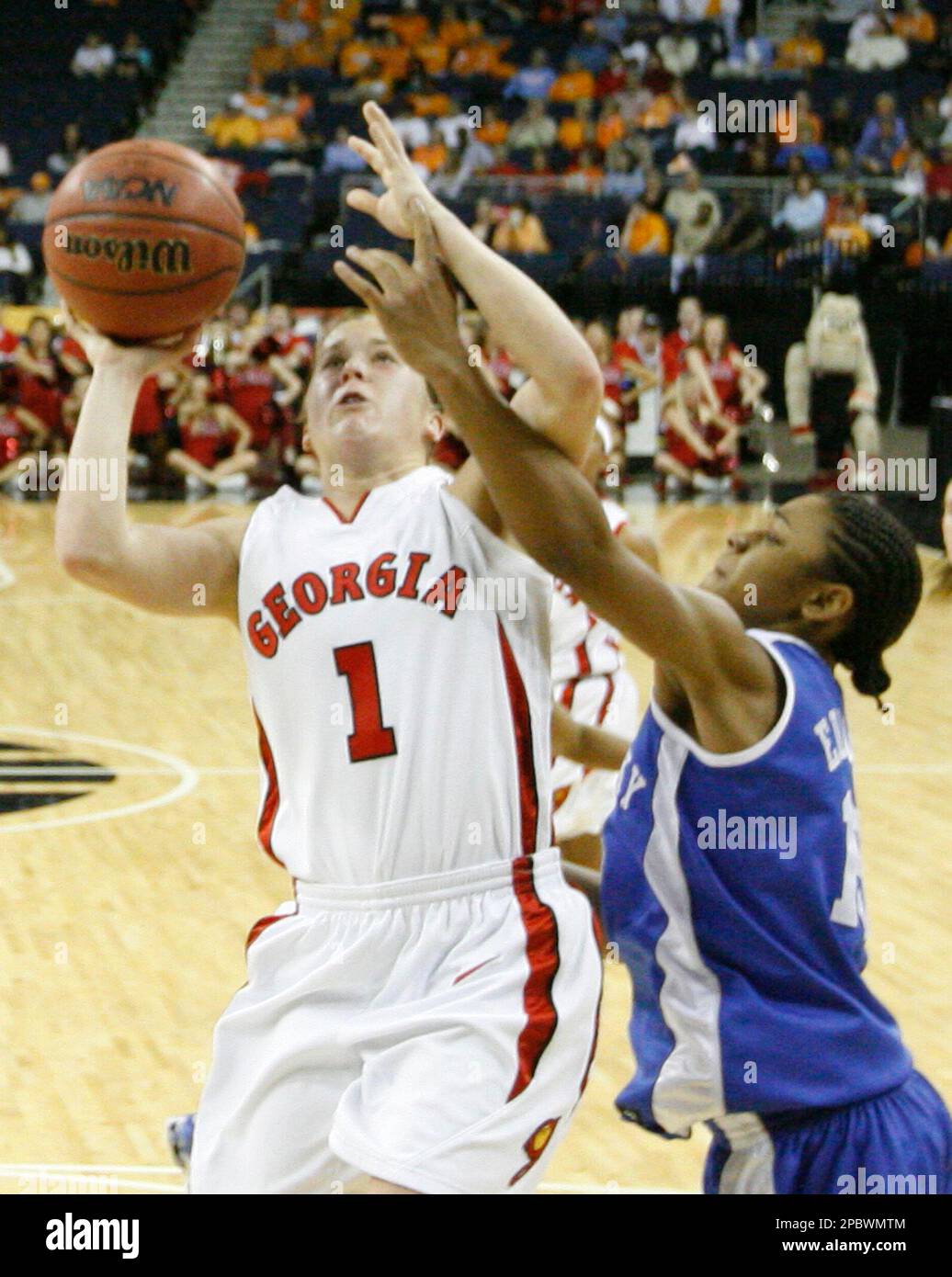 Georgia's Ashley Houts, left, puts up a shot against Kentucky's ...