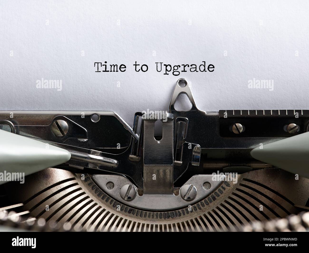 The word time to upgrade written with a vintage typewriter. Technology ...