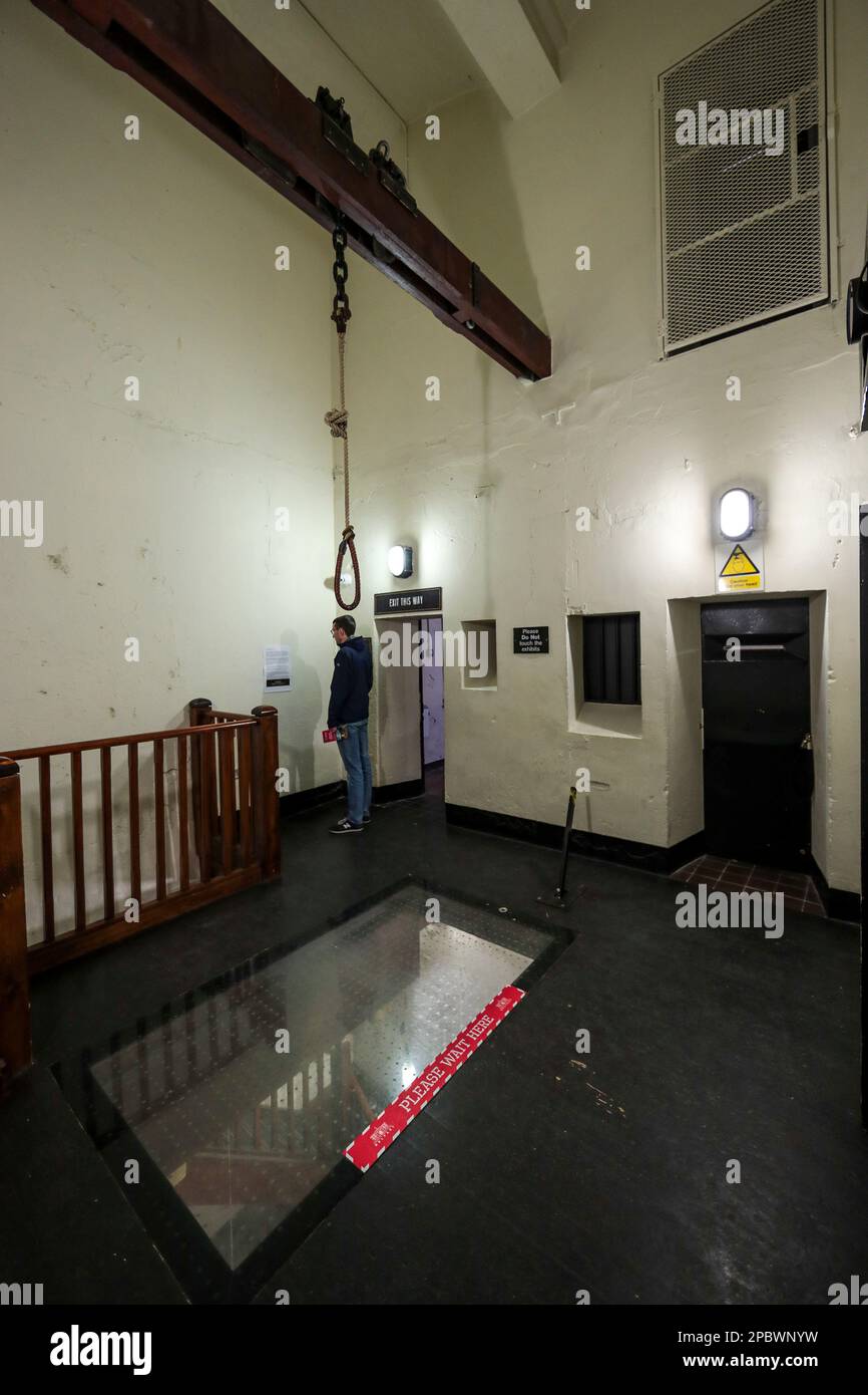 A visitor reads the interpretation board at the Hanging cell at The ...