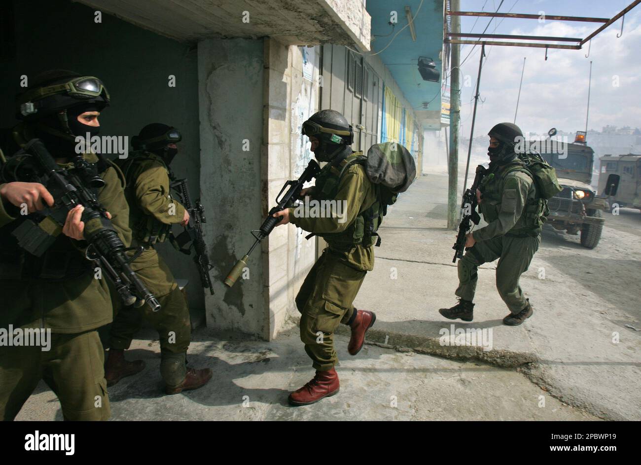 Israeli troops take position during clashes with Palestinian stone ...
