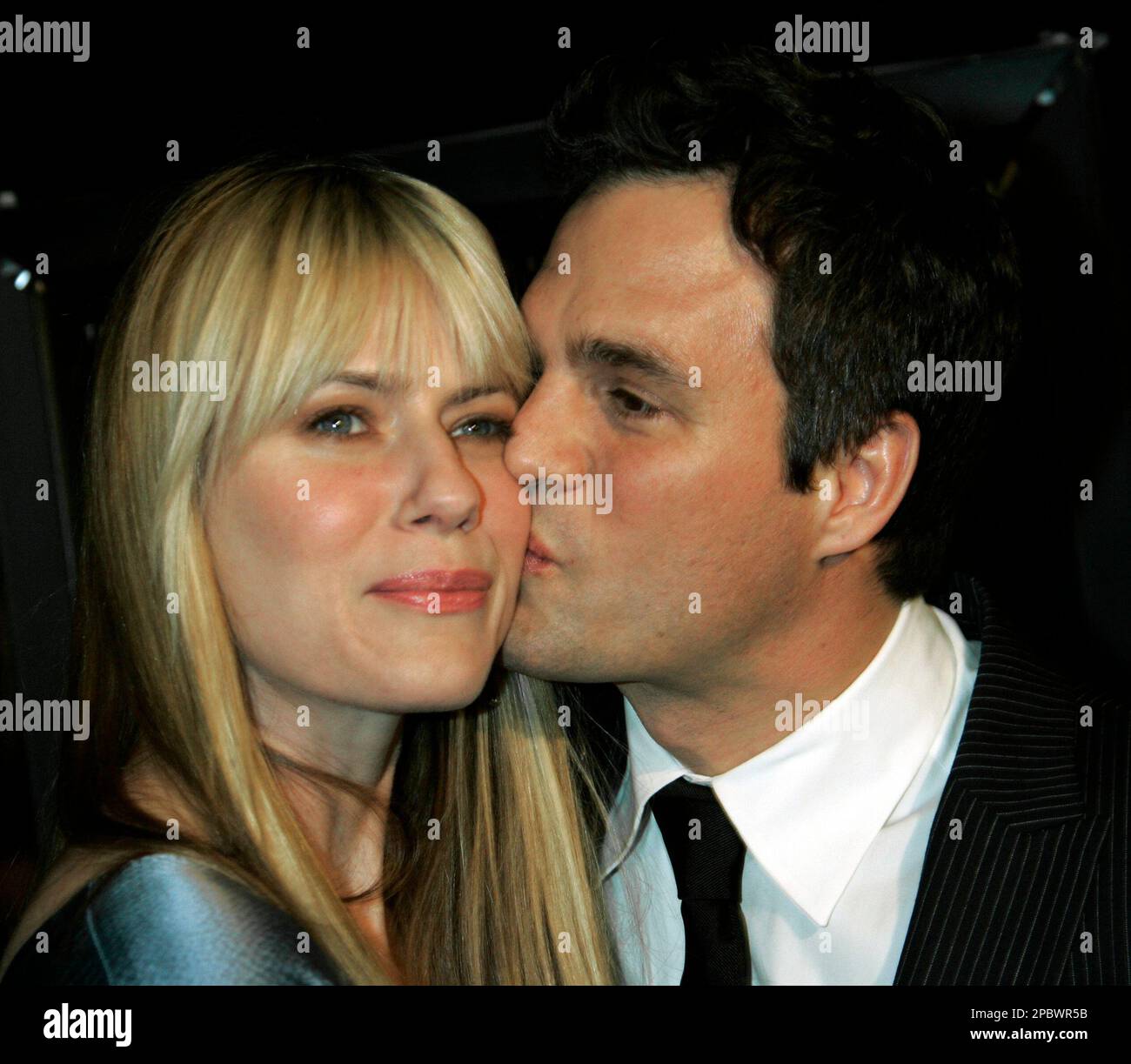 Cast member Mark Ruffalo and his wife Sunrise Coigny kiss as they ...