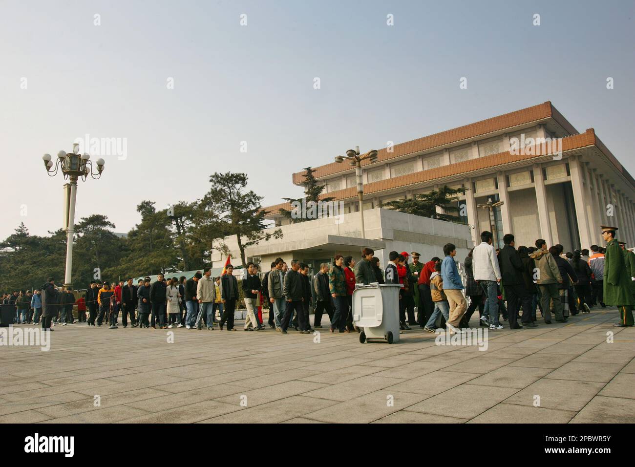 People stand in a queue at the memorial hall displaying the preserved ...