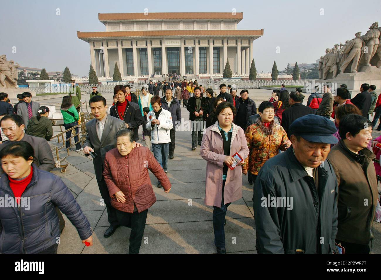 Chinese leave the memorial hall displaying the preserved remains of ...