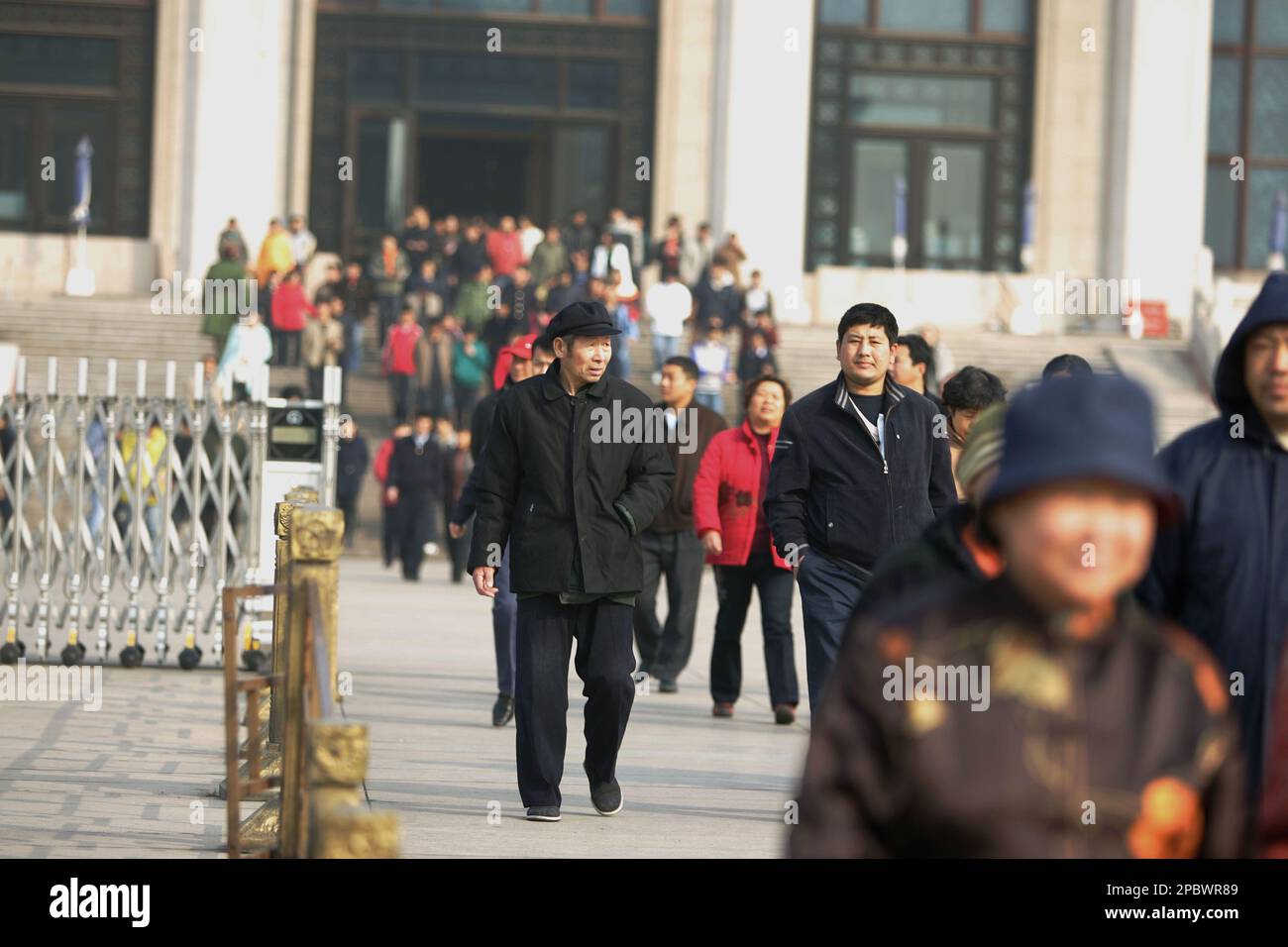 Chinese leave the memorial hall displaying the preserved remains of ...