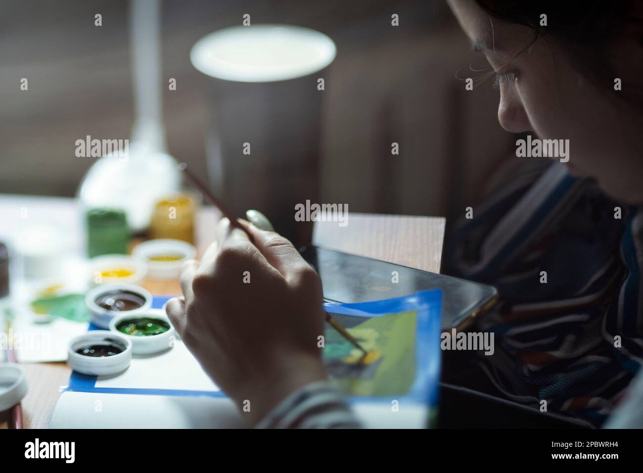 Woman in creative process of drawing Stock Photo - Alamy