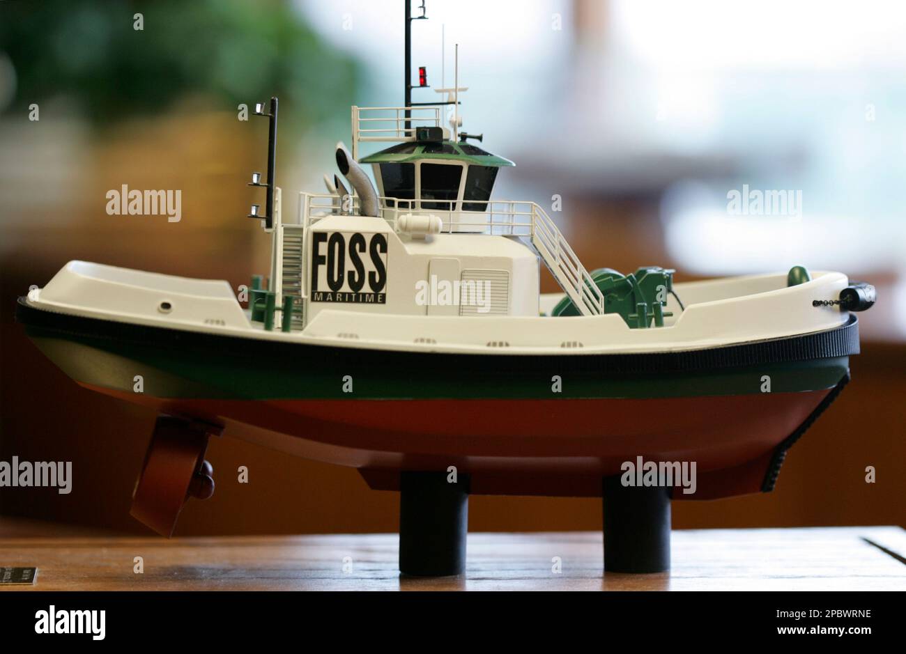 A model of a Foss electric-diesel hybrid tugboat is shown in Seattle ...