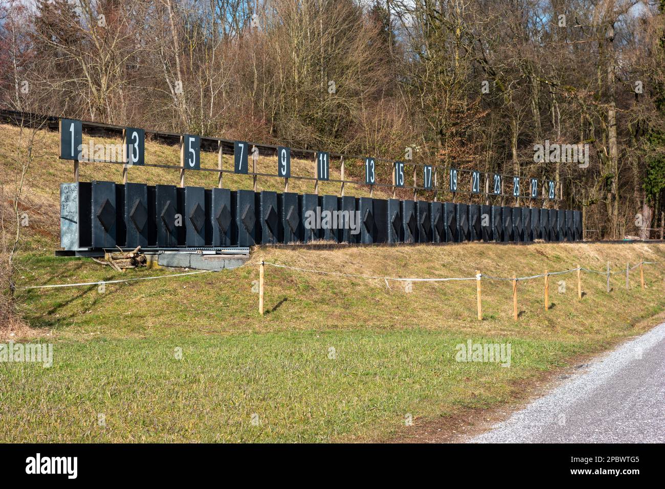 Outdoor shooting range practice targets in a numbered row. Forest scene ...