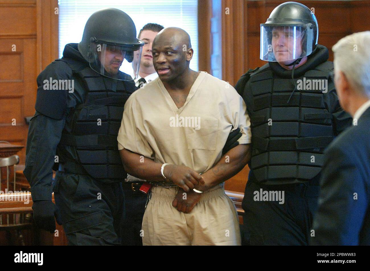 Che Sosa, center, is escorted into court during a hearing in Norfolk ...