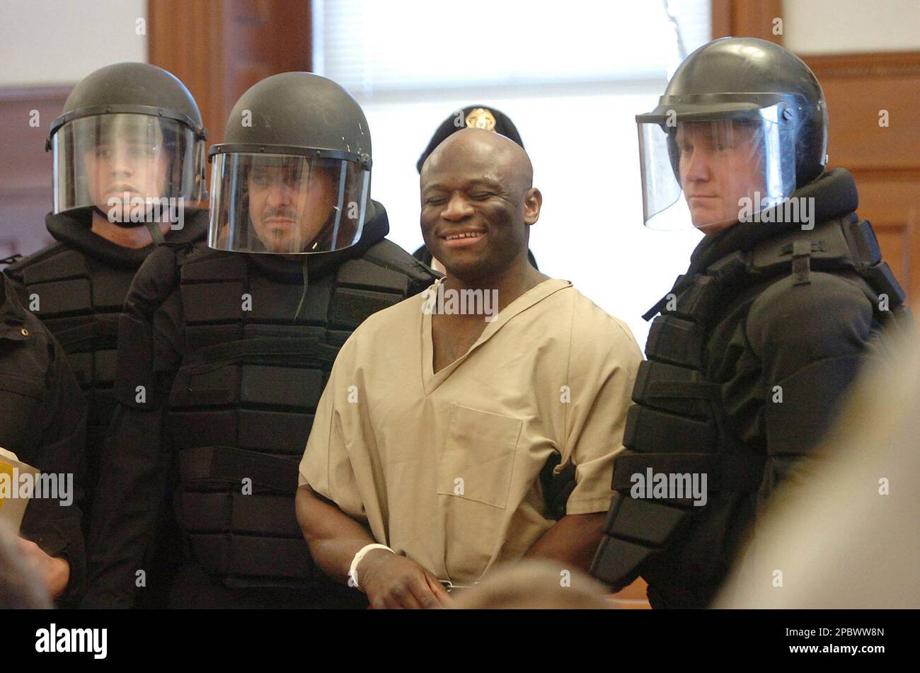 Che Sosa, center, stands surrounded by officers during a hearing in ...