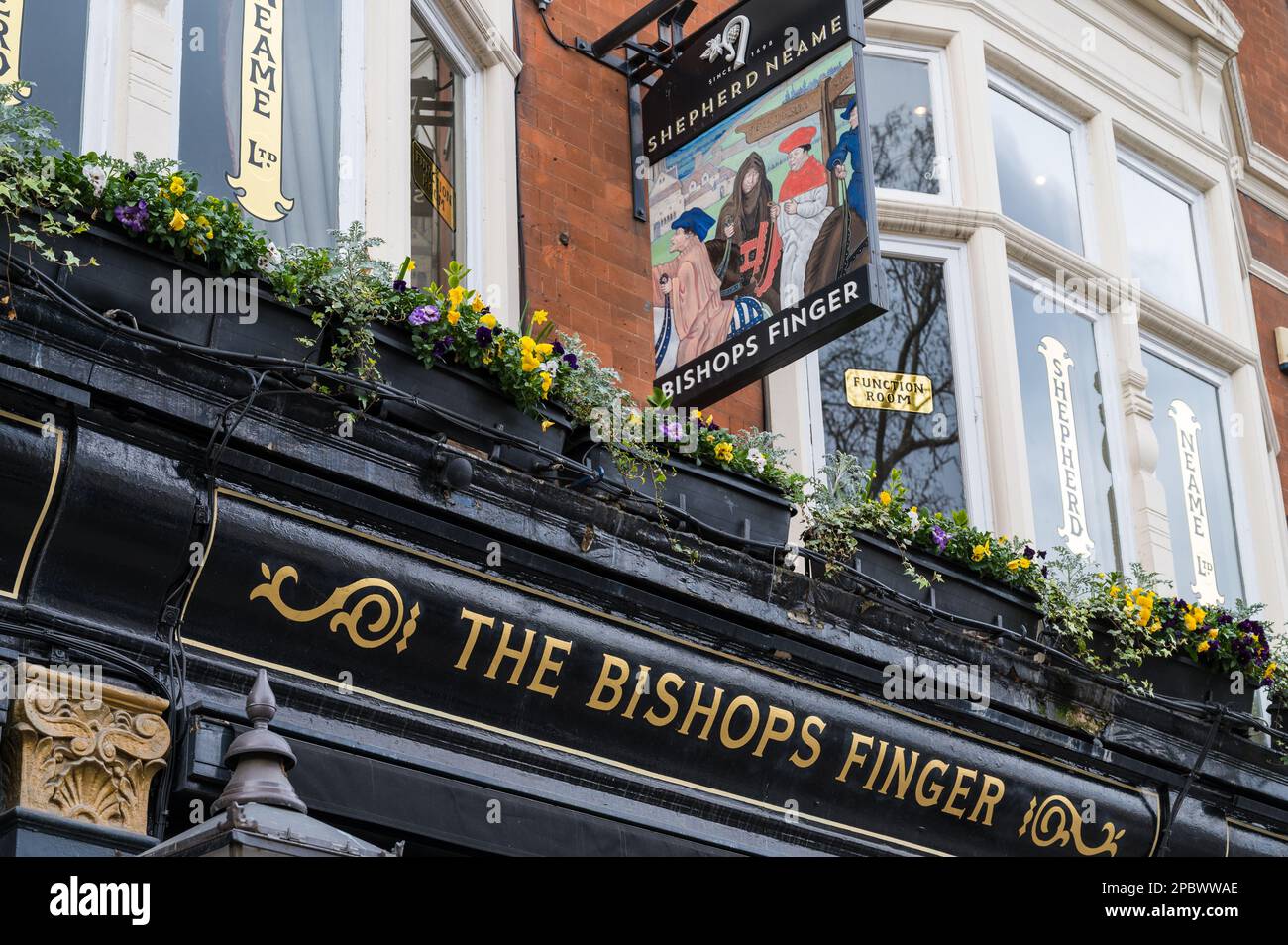 Pub sign on the front of The Bishop's Finger public house and ...
