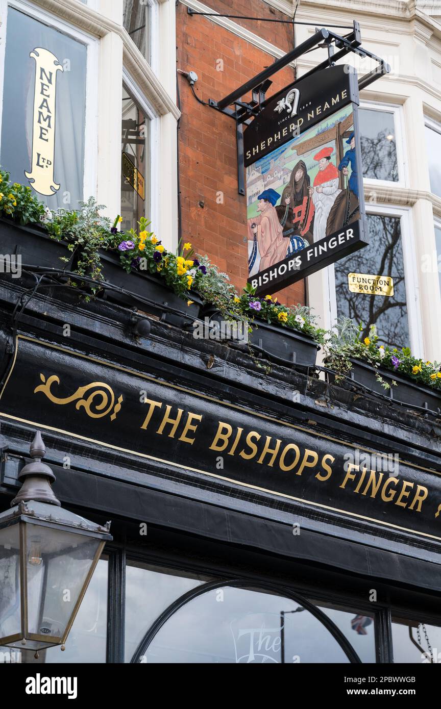 Pub sign on the front of The Bishop's Finger public house and ...